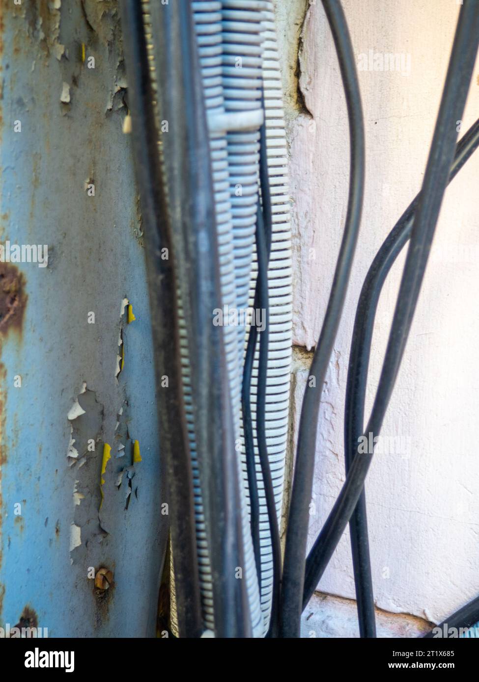 Electrical wiring on the wall outside. Sheathed wires. Energy supply ...