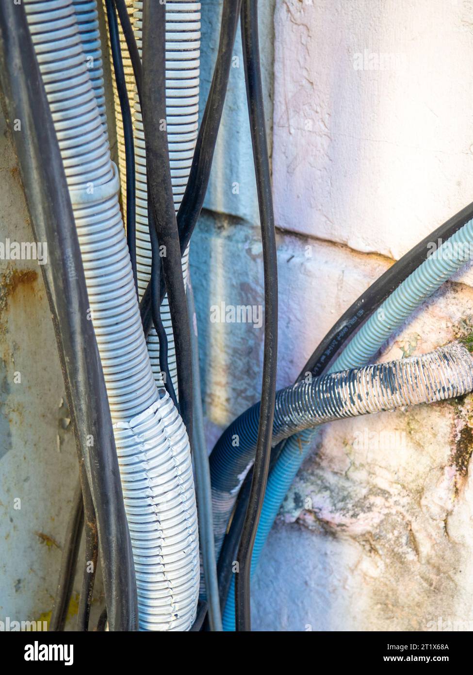 Electrical wiring on the wall outside. Sheathed wires. Energy supply ...