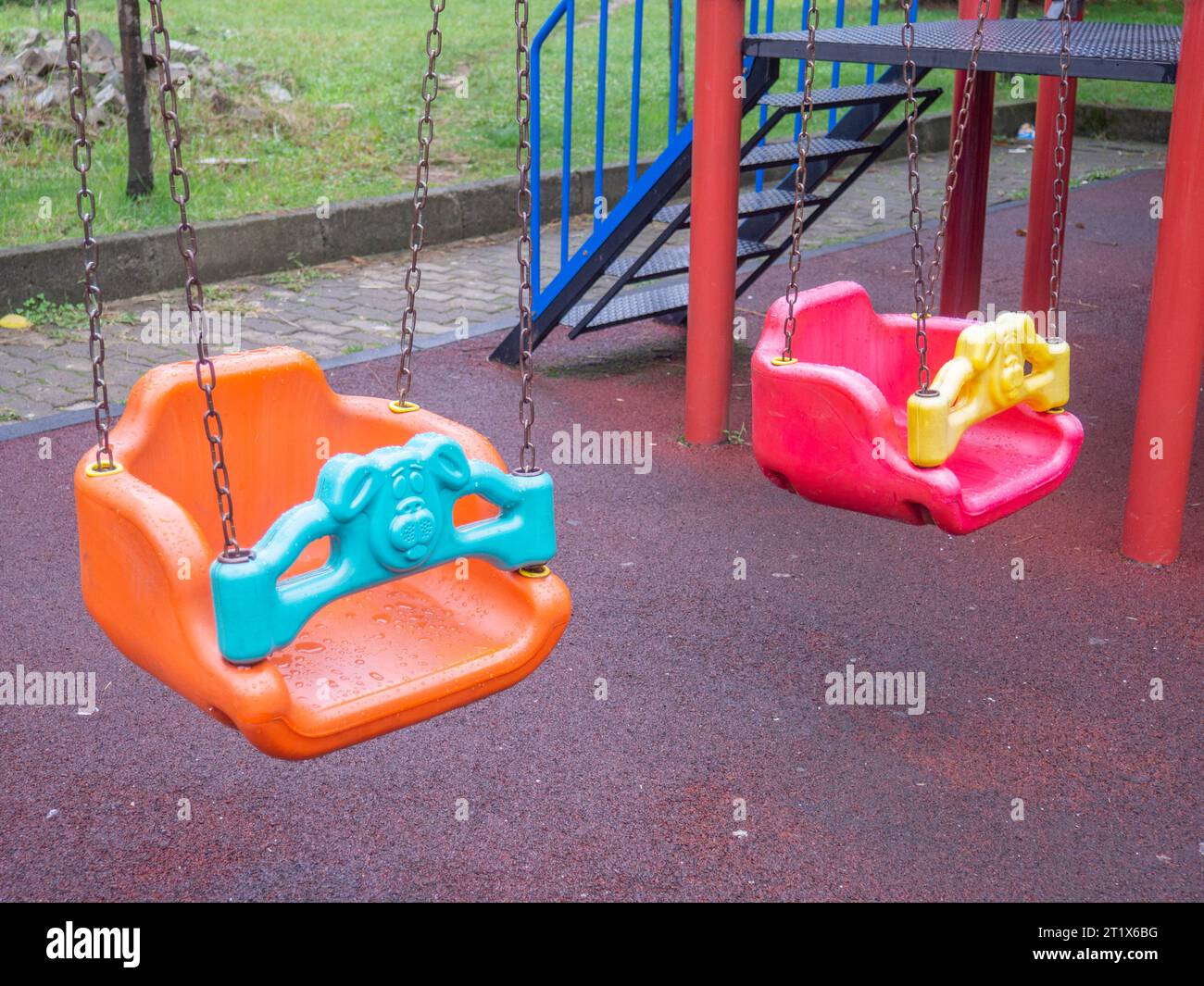 Plastic playground. Safe game for children. City infrastructure. Swings ...