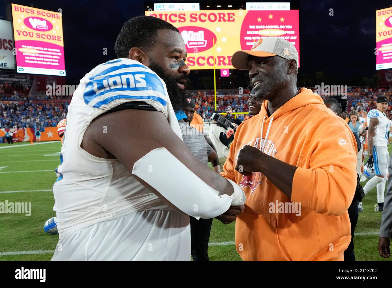 Detroit Lions defensive end Isaiah Buggs, left, and Tampa Bay ...