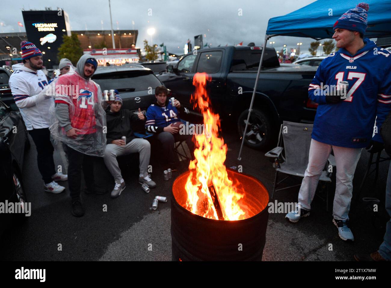 Buffalo Bills fans gather around a fire while tailgating prior to an ...