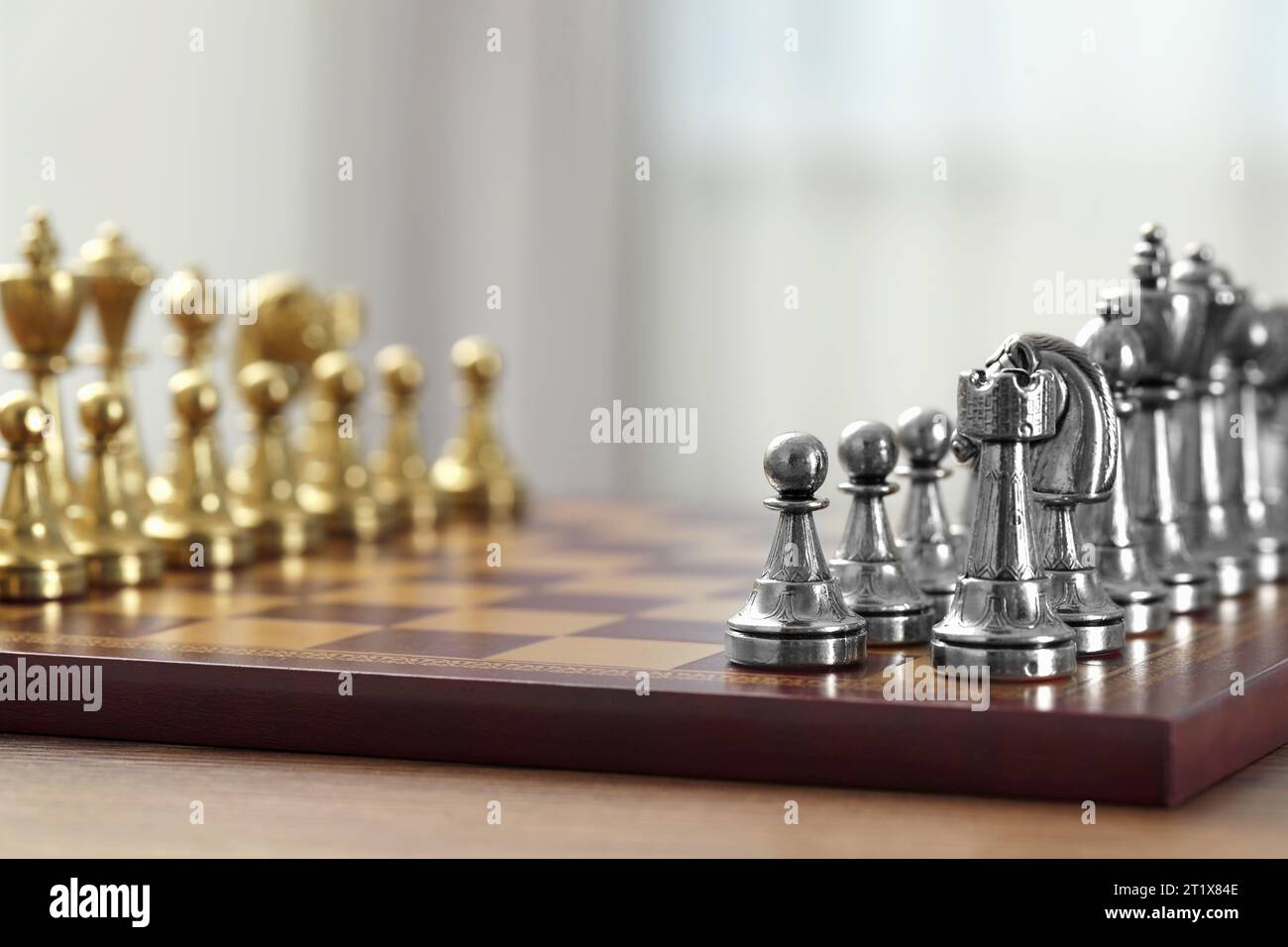 Set of chess pieces on checkerboard before game, selective focus. Space ...