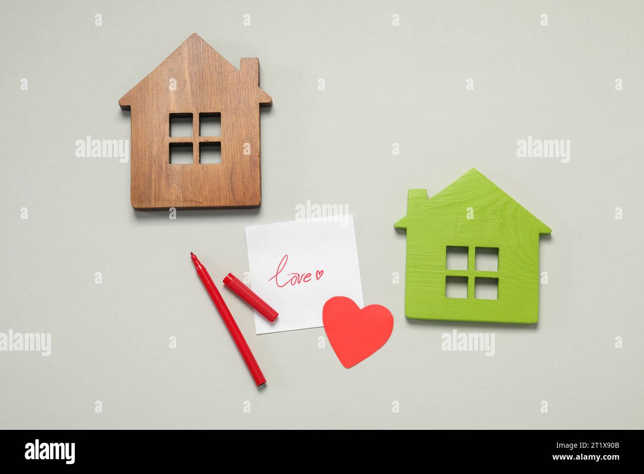 Long-distance relationship concept. Love note, paper heart and marker ...