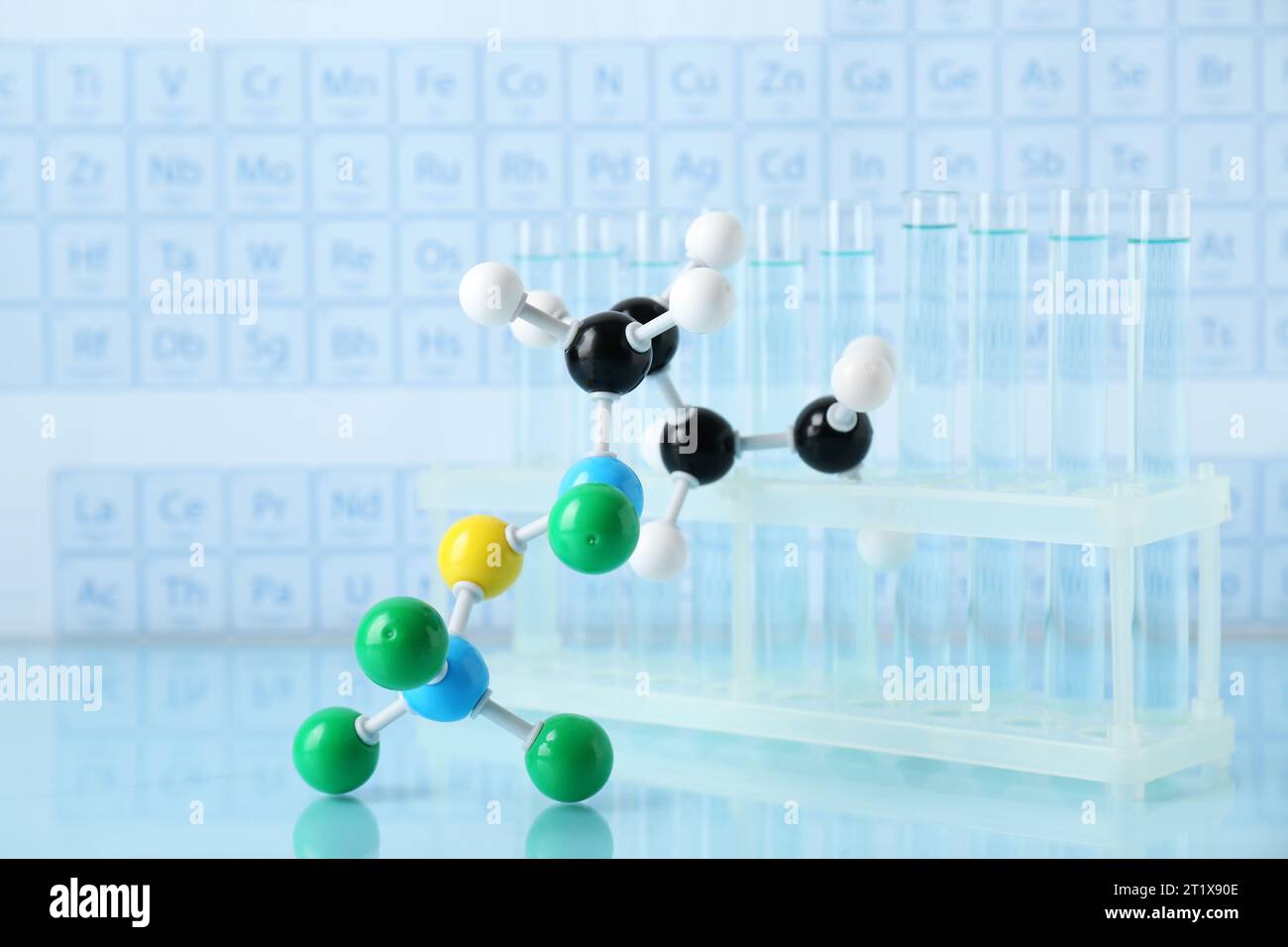 Molecular model and test tubes on light surface Stock Photo - Alamy