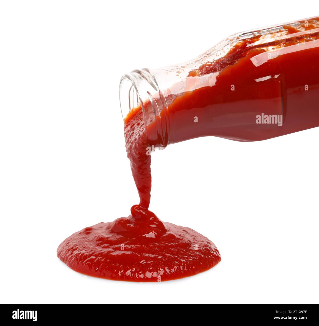 Pouring tasty red ketchup from glass bottle isolated on white Stock ...