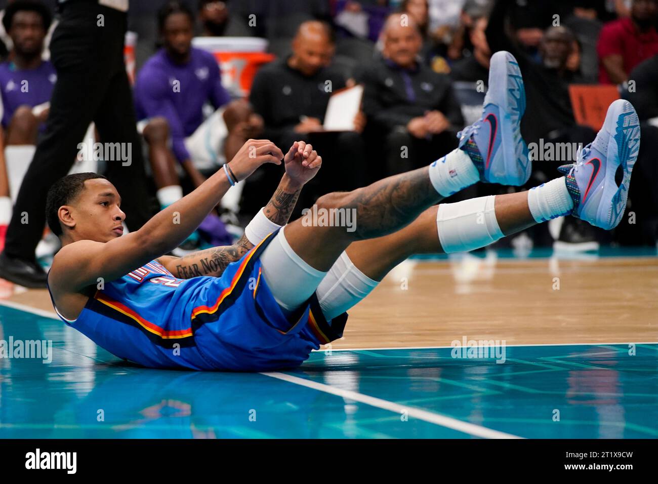 Oklahoma City Thunder guard Tre Mann takes a fall while attempting a ...