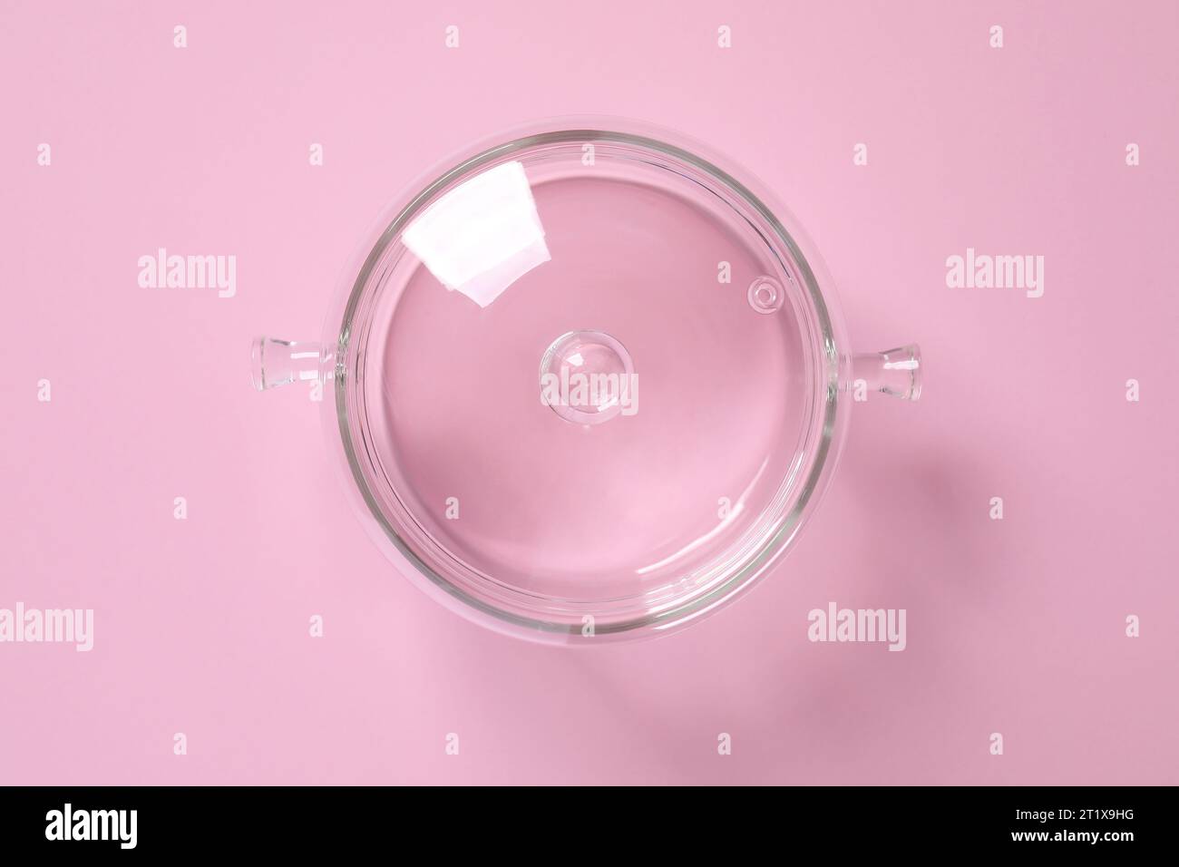 Glass pot with lid on pink background, top view Stock Photo - Alamy