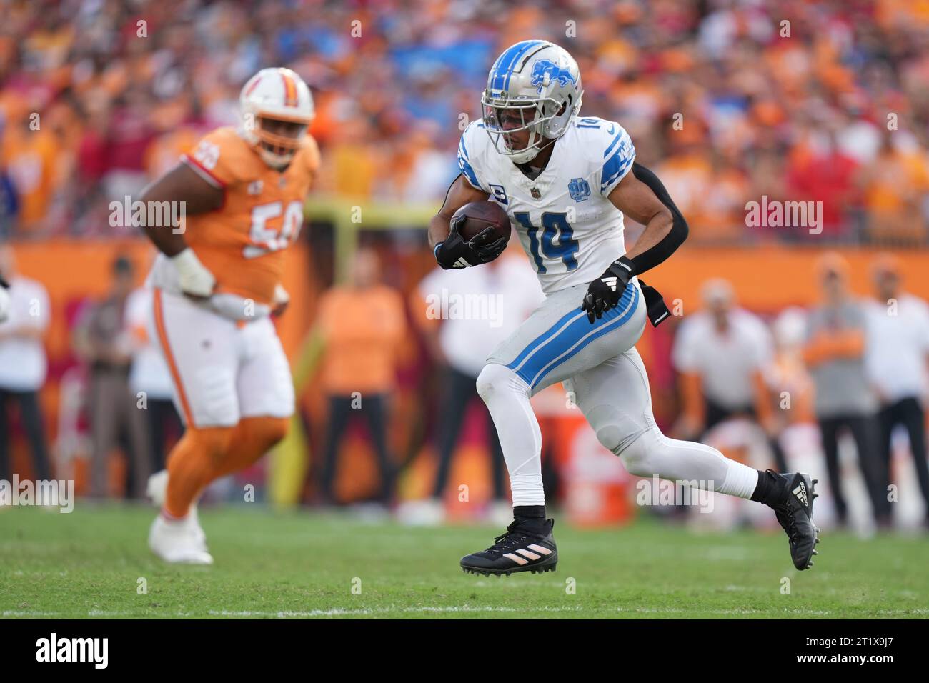 Detroit Lions wide receiver Amon-Ra St. Brown (14) runs for a touchdown ...