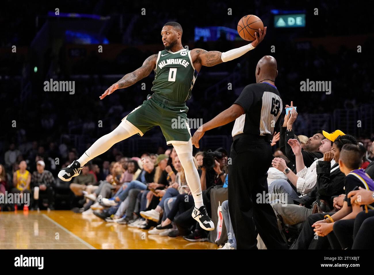 Milwaukee Bucks forward MarJon Beauchamp jumps to keep a ball inbounds ...