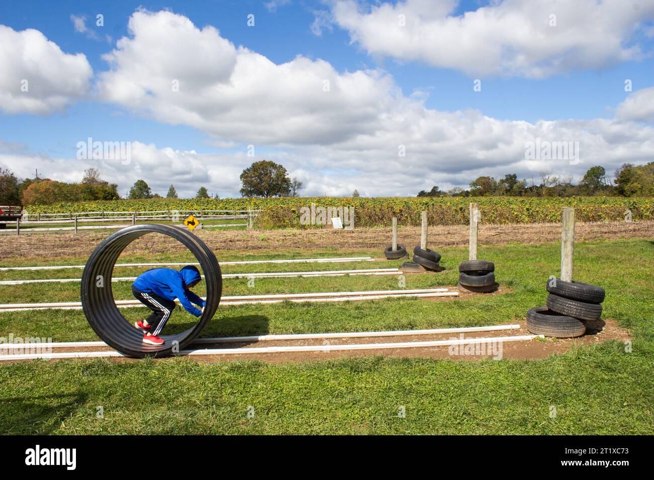 Hellerick's Family Farm, Kid is inside the big pipe and rolling along ...