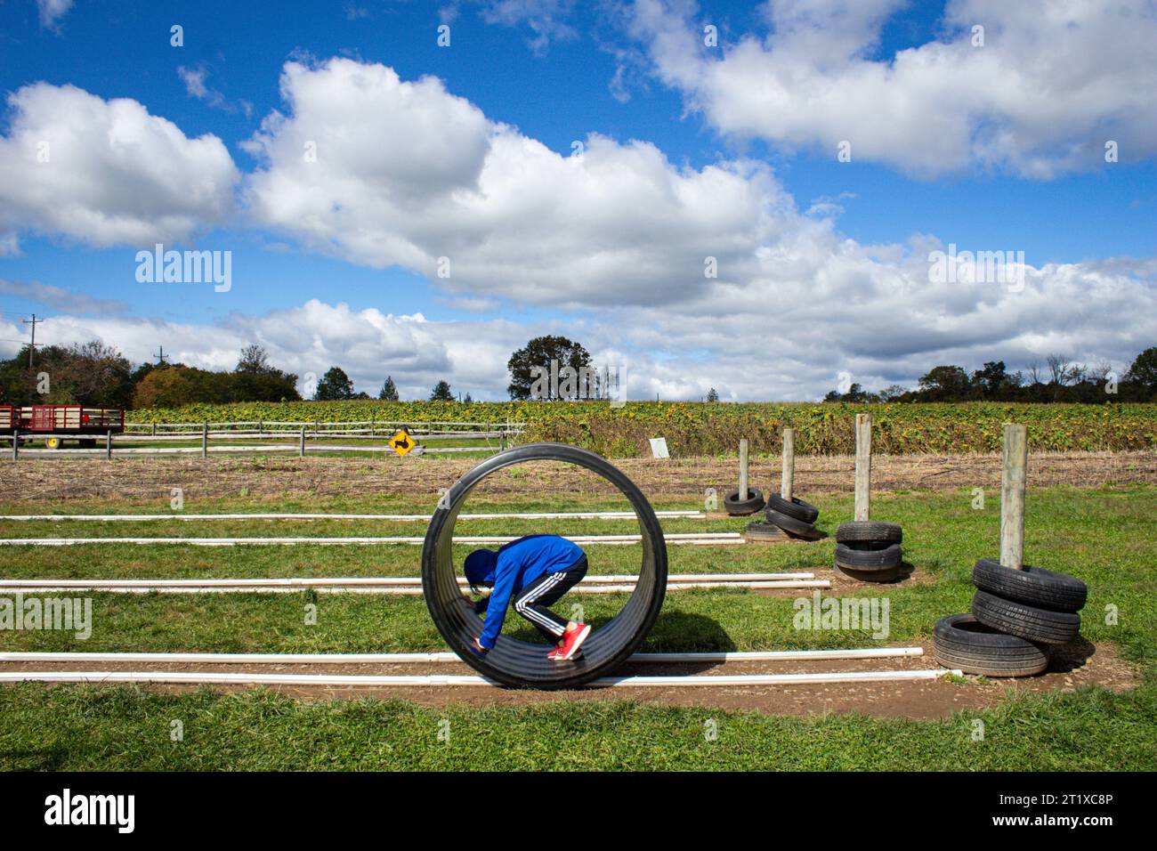Hellerick's Family Farm, Kid is inside the big pipe and rolling along ...