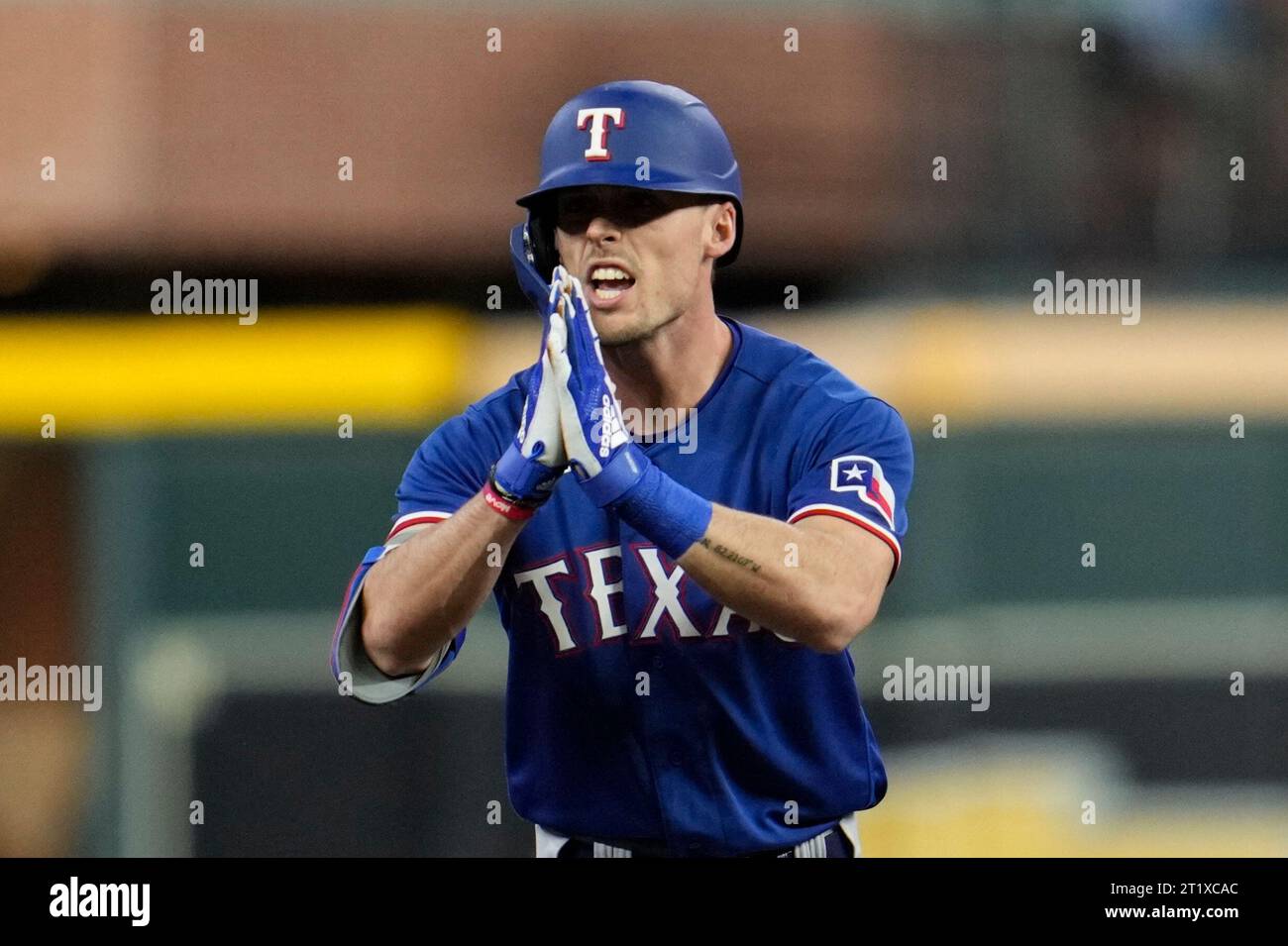 Texas Rangers' Evan Carter reacts after getting to second on a hit ...