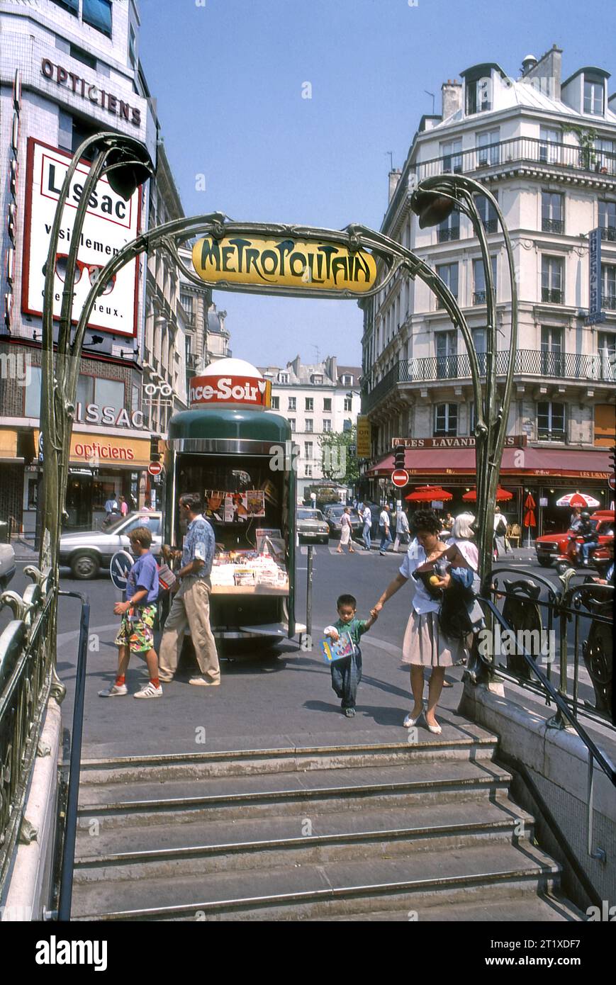 Street scene with sign and entrance to the Metropolitan underground ...