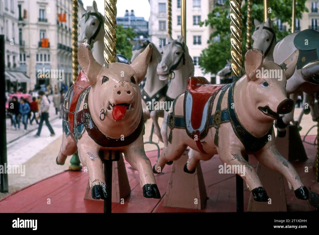 Antique carousel with pigs and horses in a small park in Paris, France ...