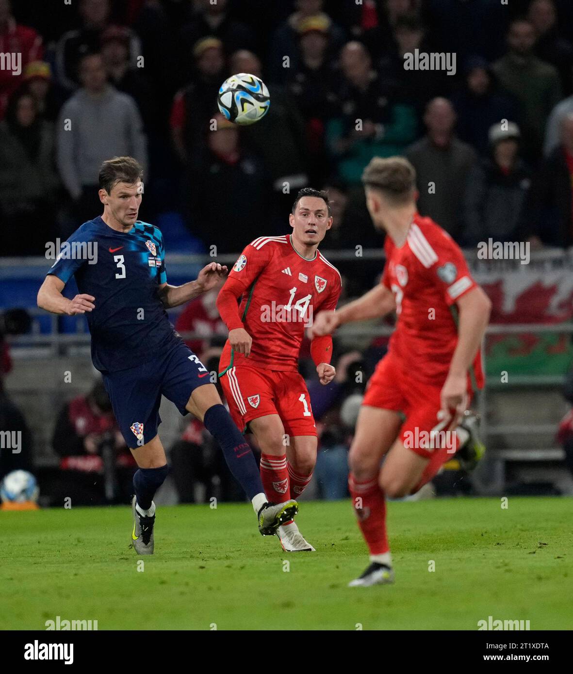 Cardiff,UK, 15 Oct 2023 Connor Roberts (Wales) (C) heads ball clear ...