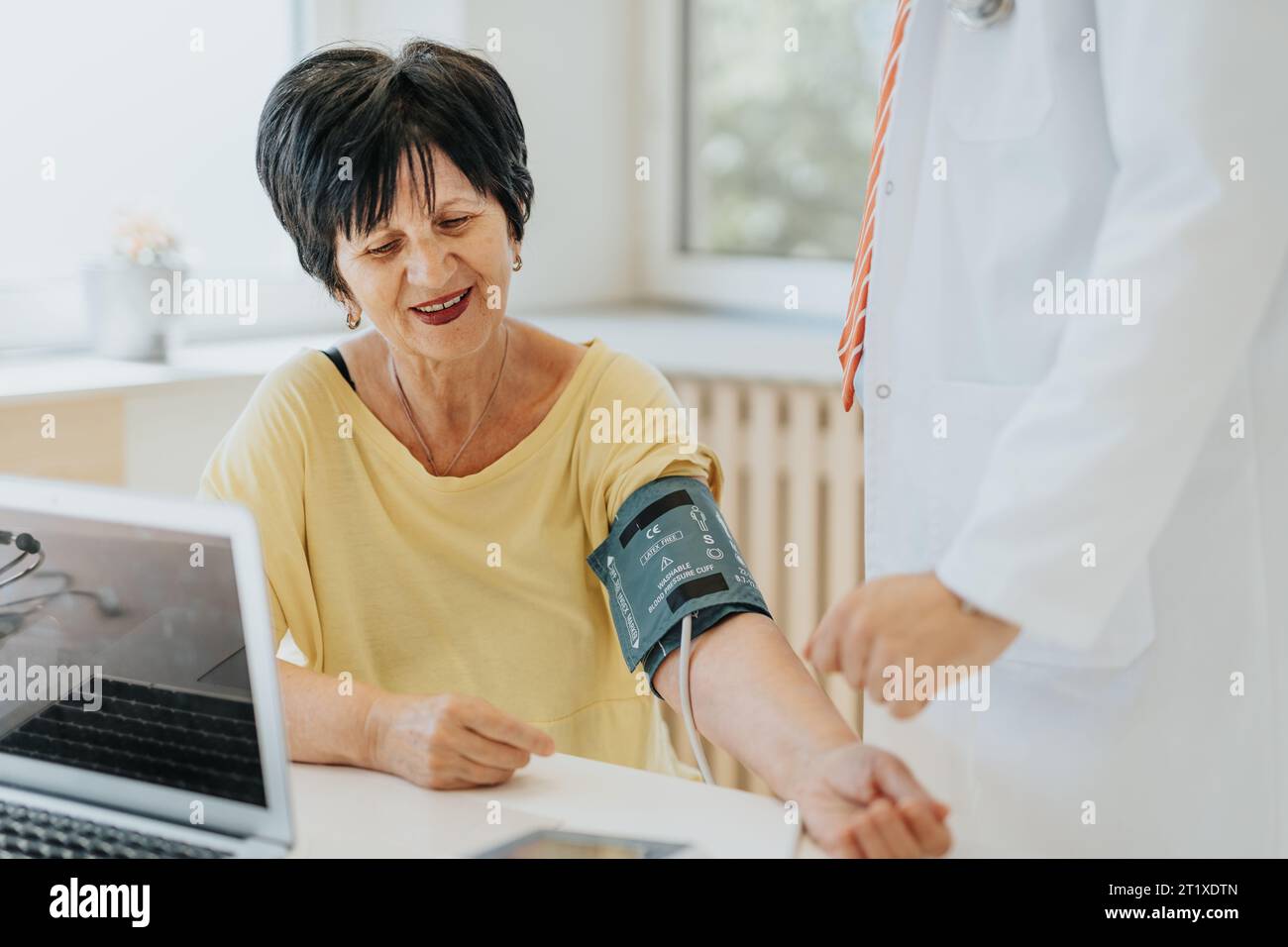Expert Cardiologist Monitoring Elderly Woman's Heart Rate in Hospital ...