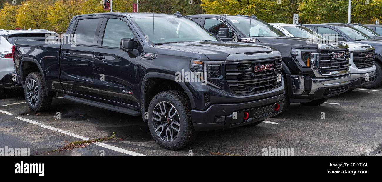 A line of GMC pickup trucks for sale at a dealership in Monroeville ...