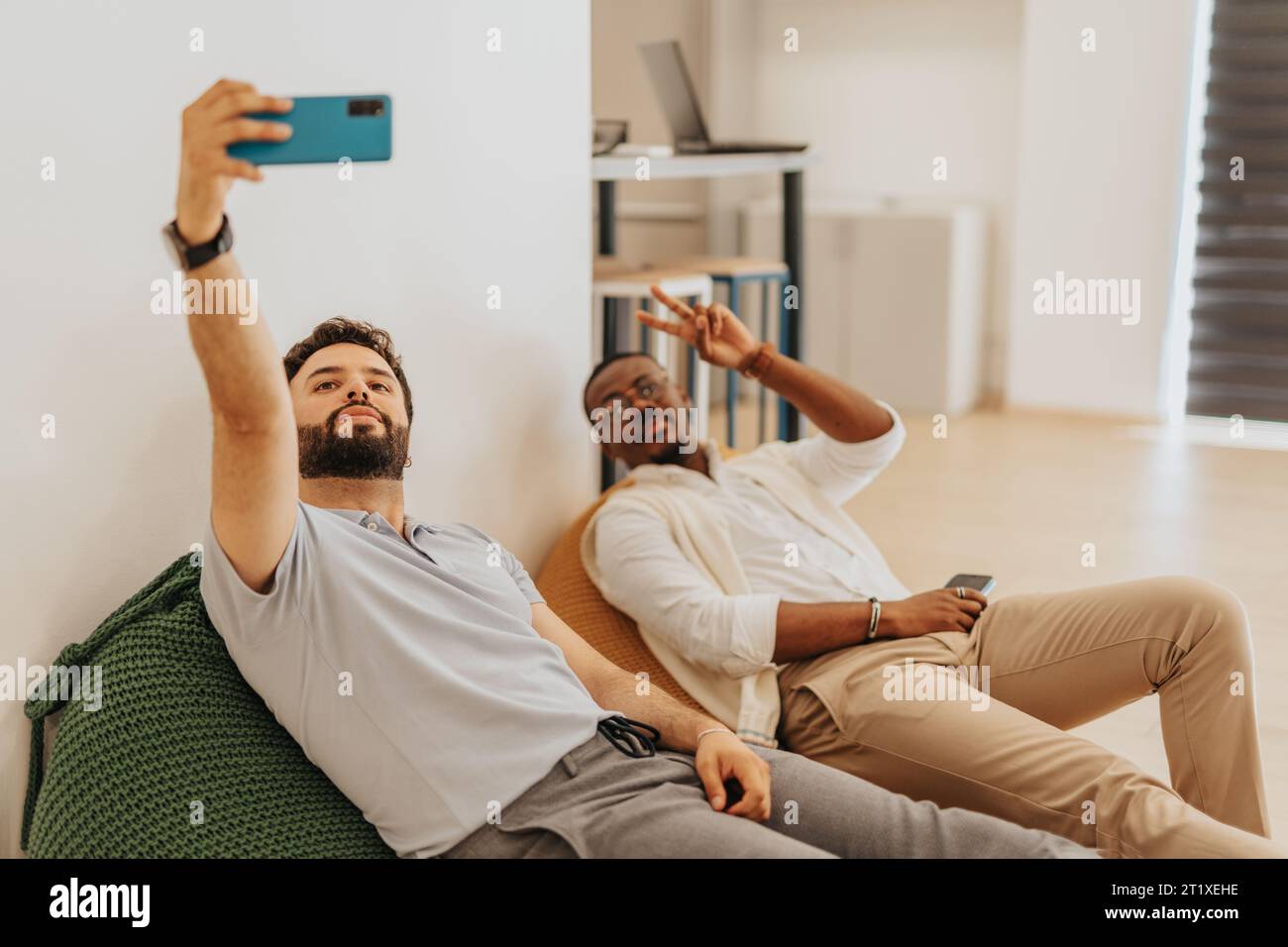 Multiracial employees taking a selfie at work Stock Photo - Alamy