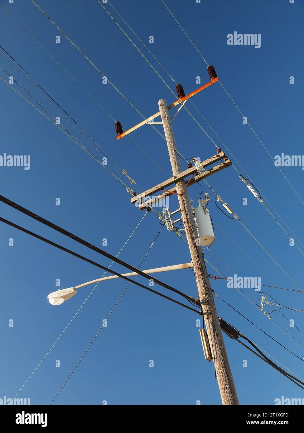 Tall utility pole with electric, cable and telephone facilities with a ...