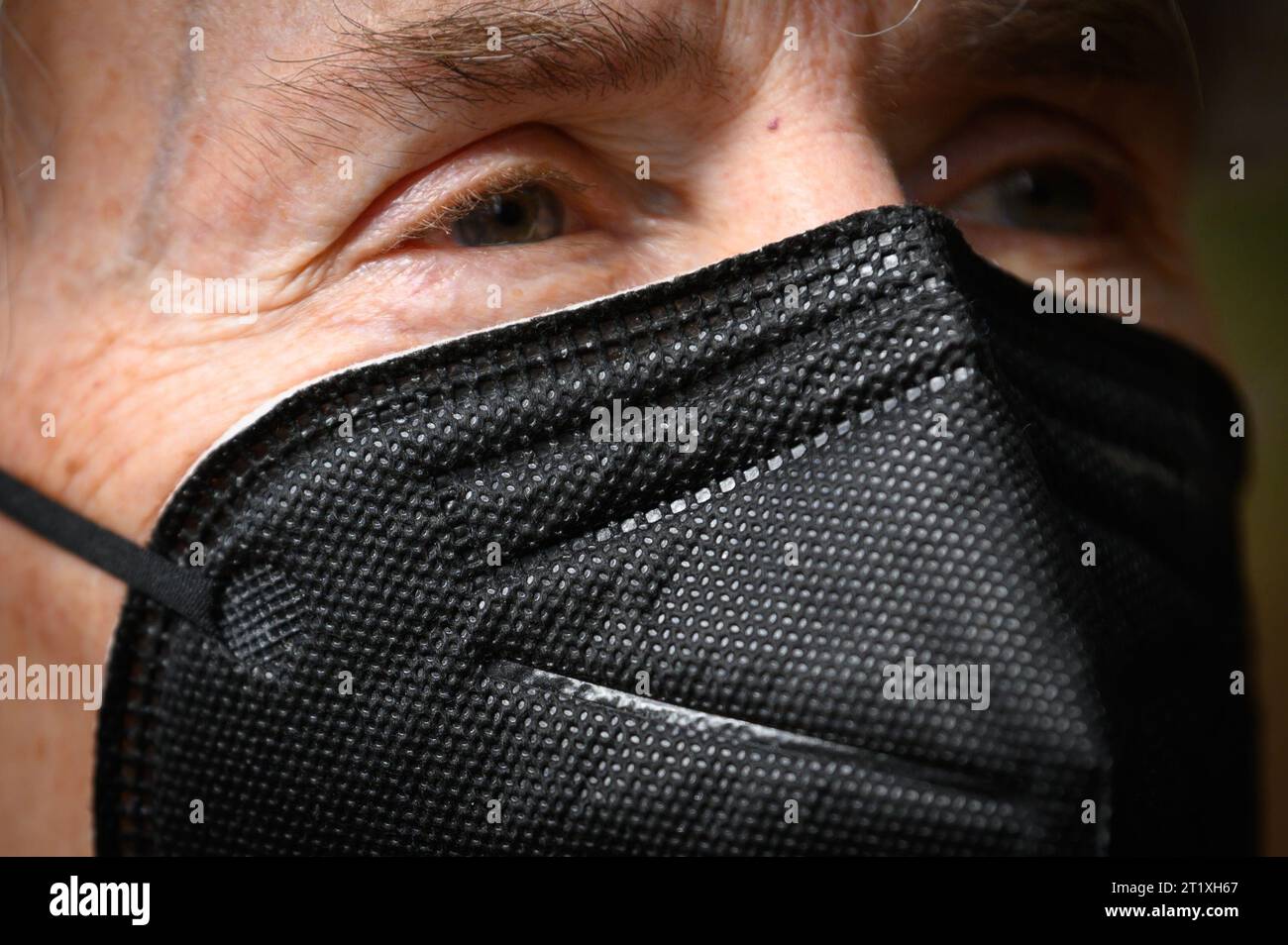 Woman wears an N95 face mask of the type in common usage due to ...