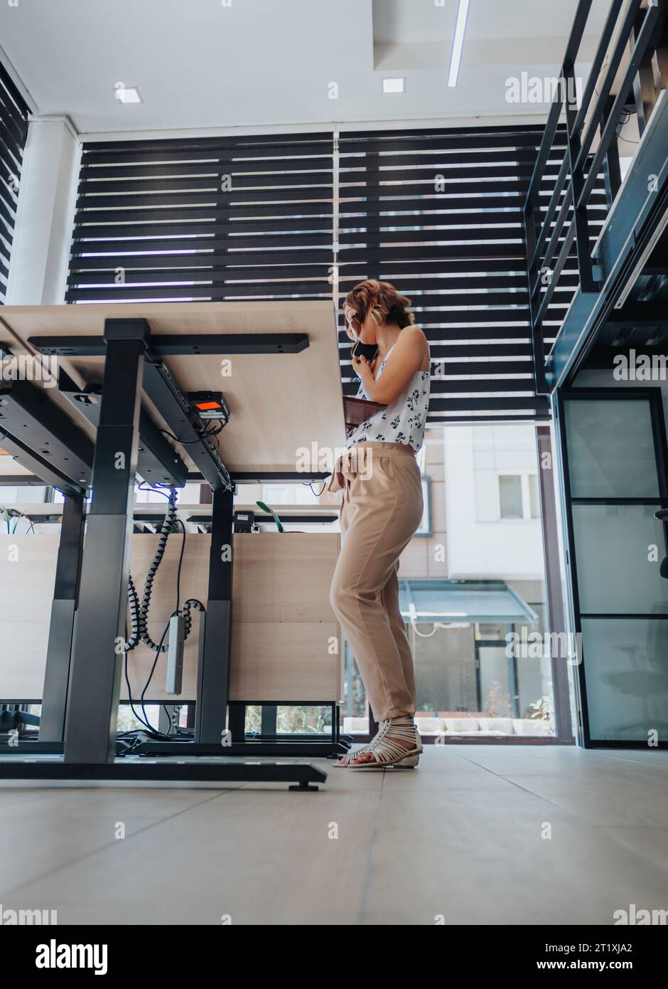 Business girl working alone at the office. Low angle photo Stock Photo ...