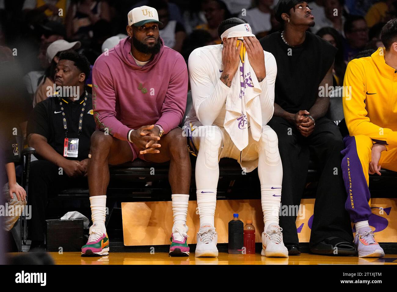 Los Angeles Lakers' LeBron James, left, and forward Anthony Davis sit ...