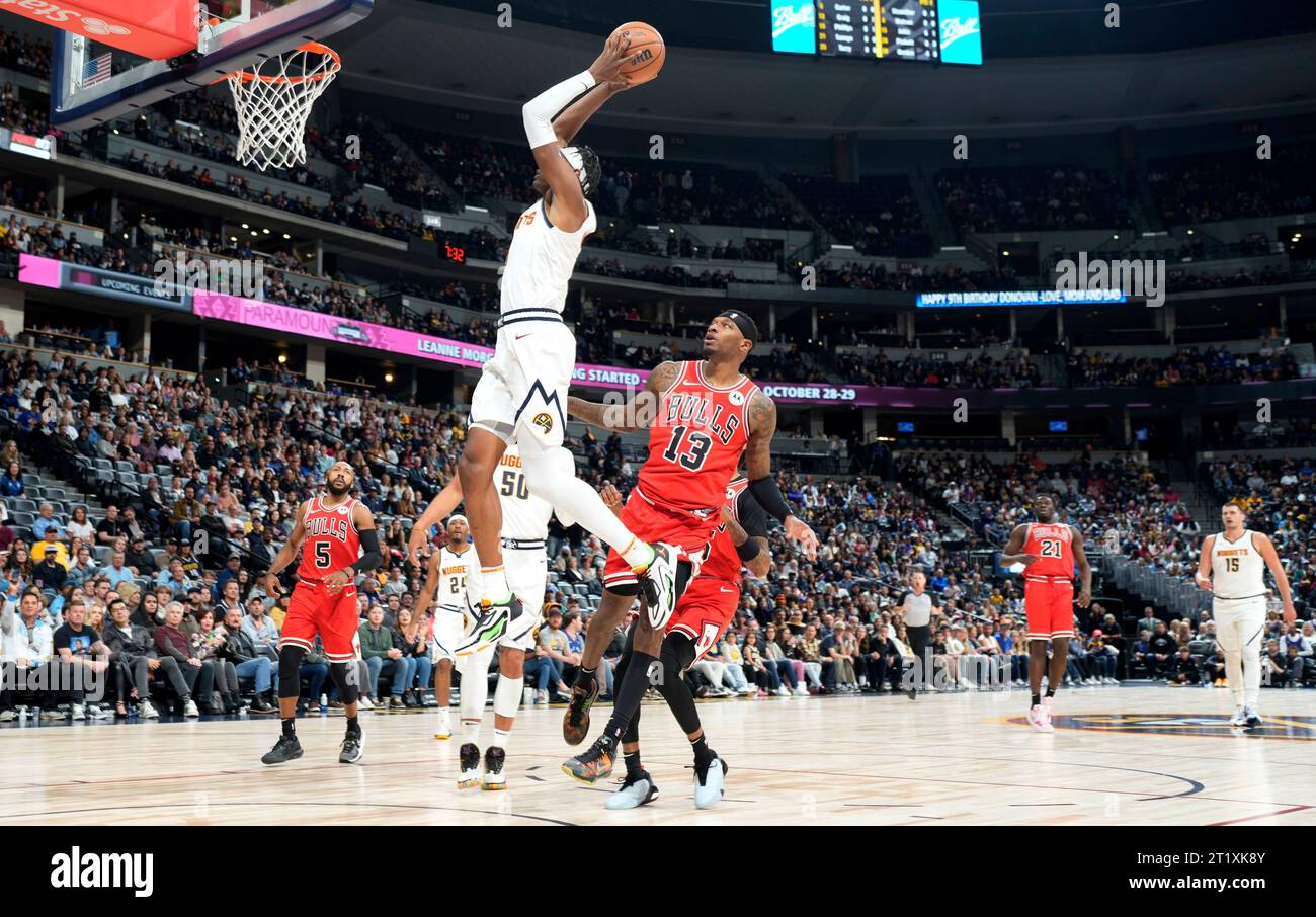 Denver Nuggets forward Peyton Watson, left, goes up for a basket as ...