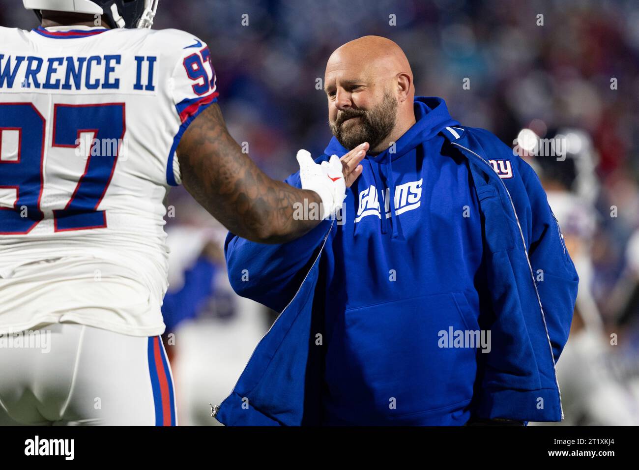 New York Giants head coach Brian Daboll greets defensive tackle Dexter ...