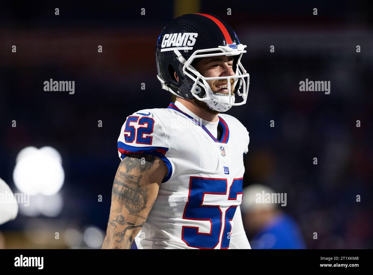 New York Giants linebacker Carter Coughlin (52) warms up before an NFL ...