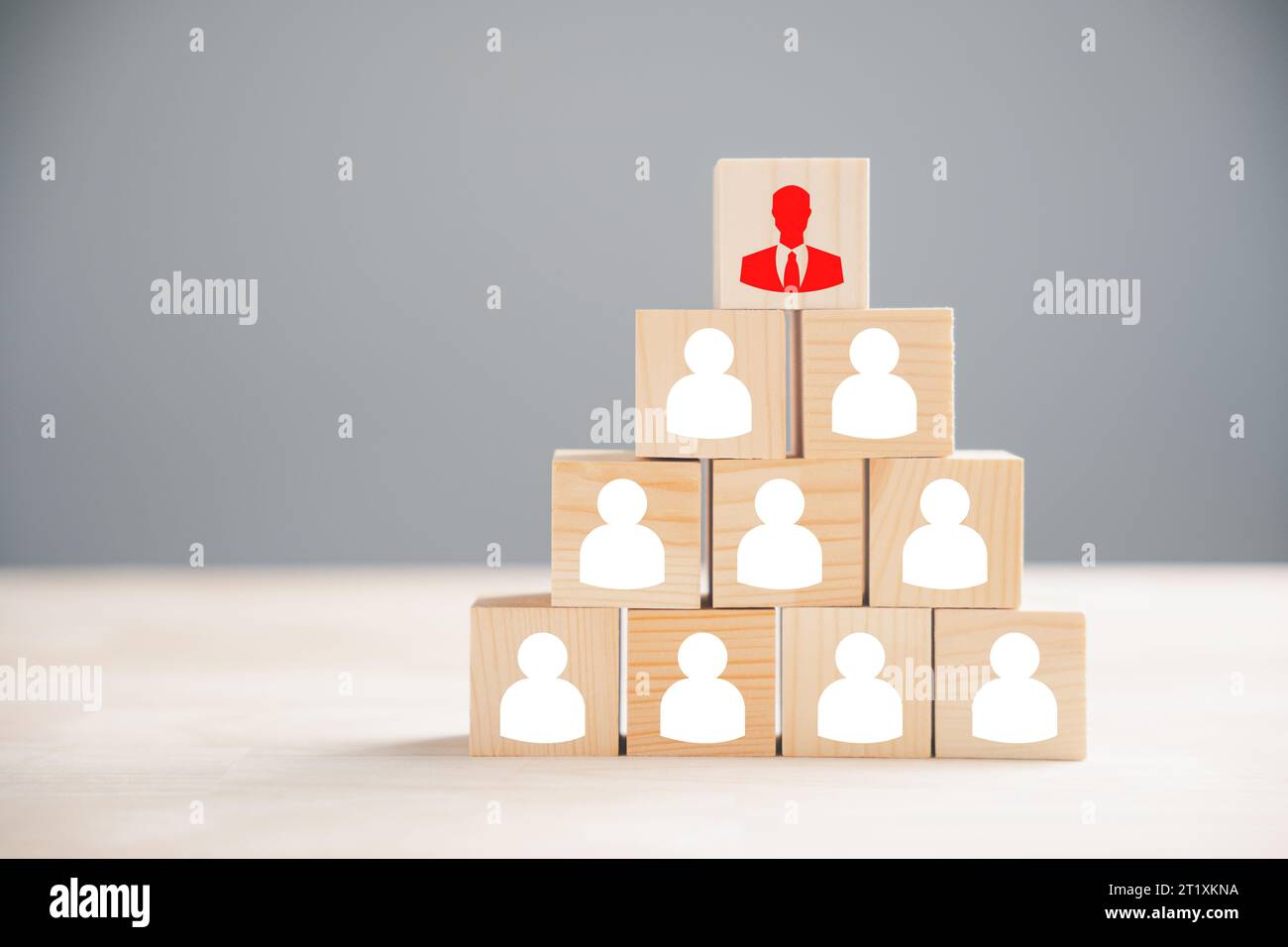 A red manager icon that stands out distinctively from a group of staff ...