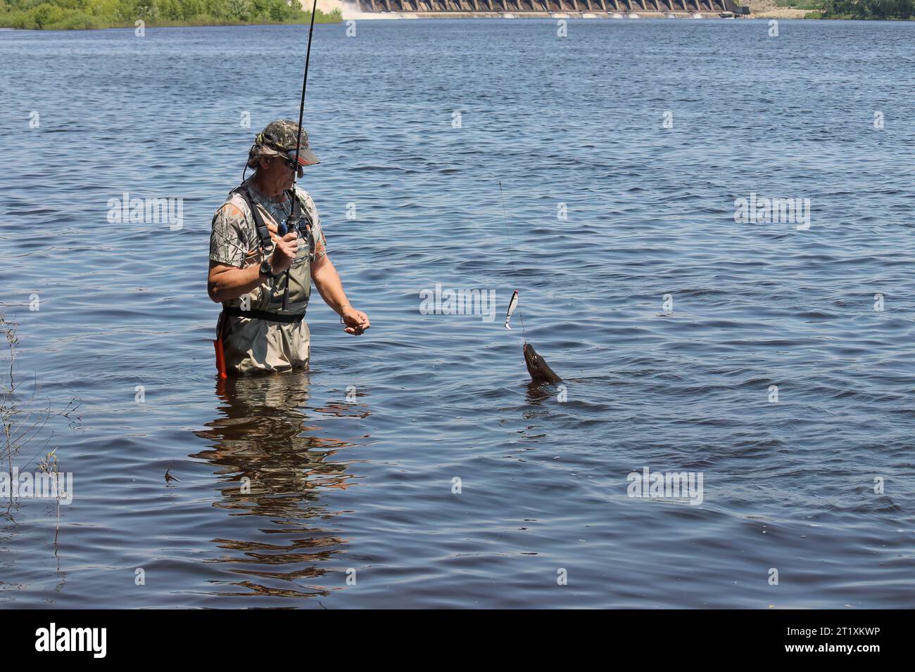 Fishing. One of a series of photos of fishermen catching northern pike ...