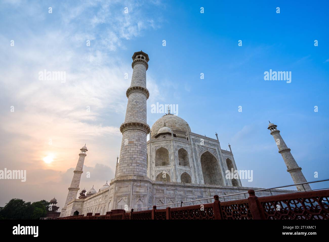 Side view of the Taj Mahal's white domes and white towers at sunset ...