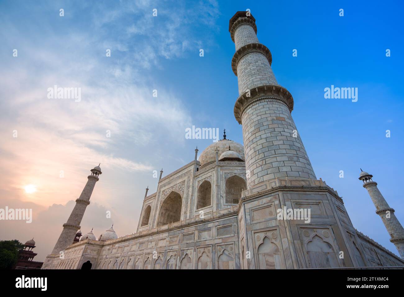 Side view of the Taj Mahal's white domes and white towers at sunset ...