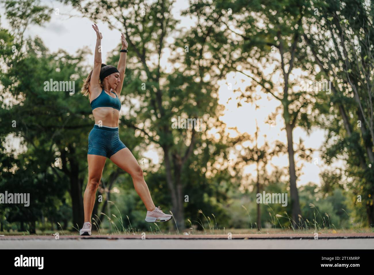 Fit and flexible athletic girl performing impressive 360 degree ...