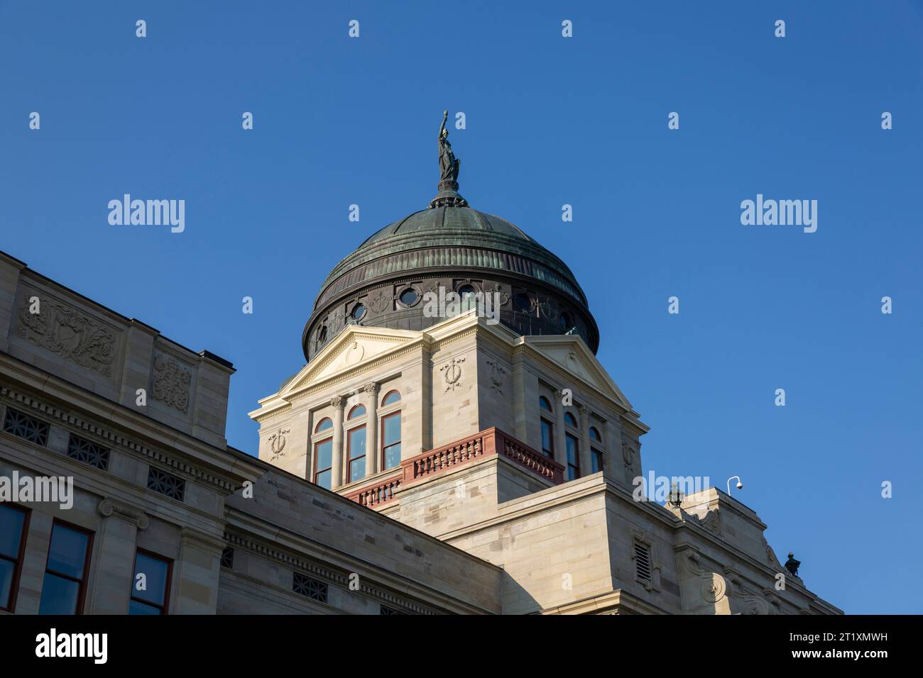 The Montana Statue crowns the copper dome of the Montana State Capitol ...