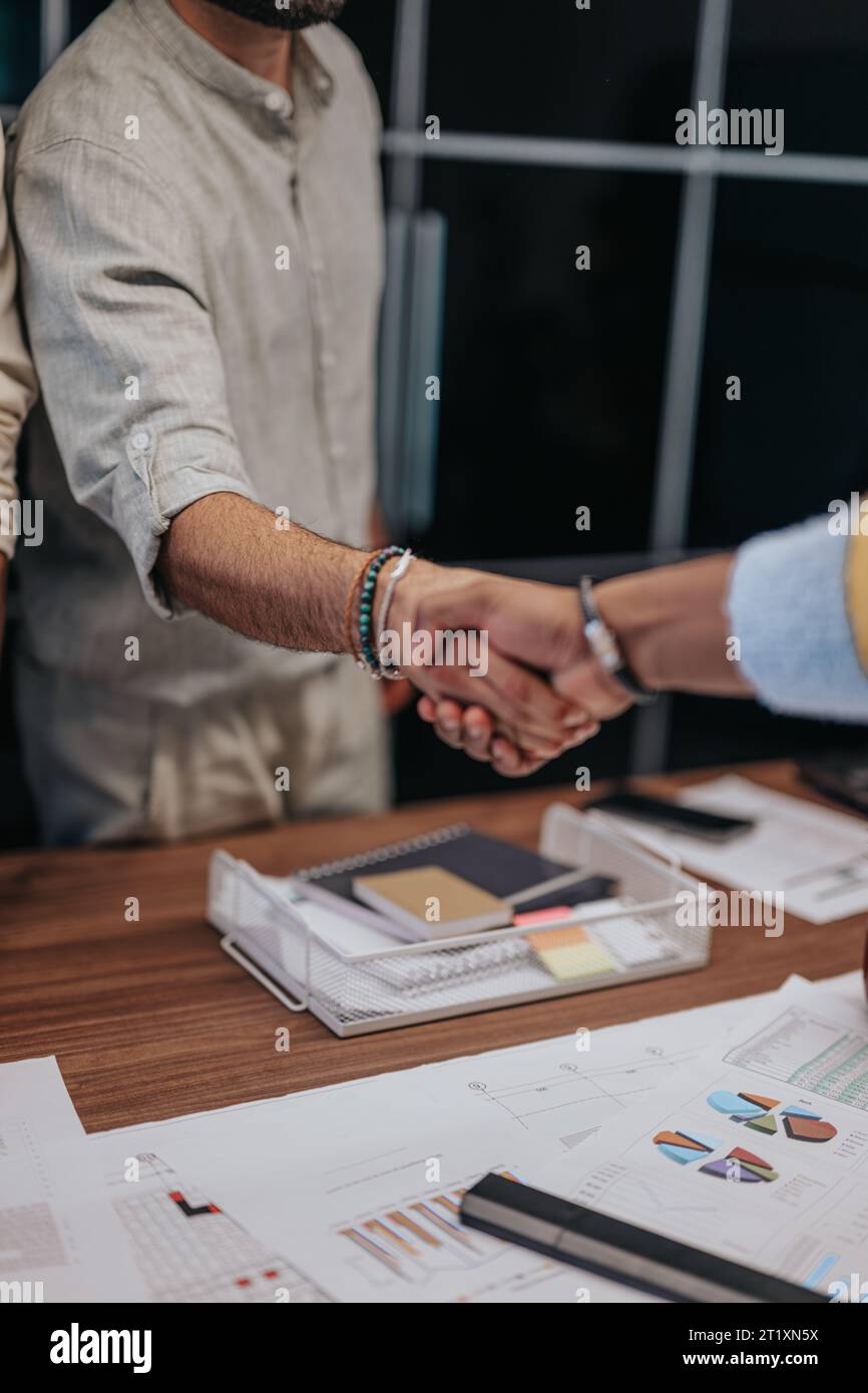 A touching moment of saying goodbye and shaking hands between business ...