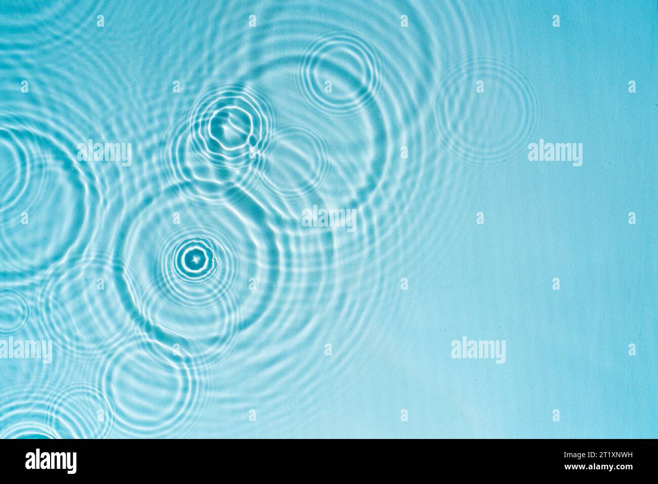 Raindrops on the surface of the water. Swimming pool water background ...