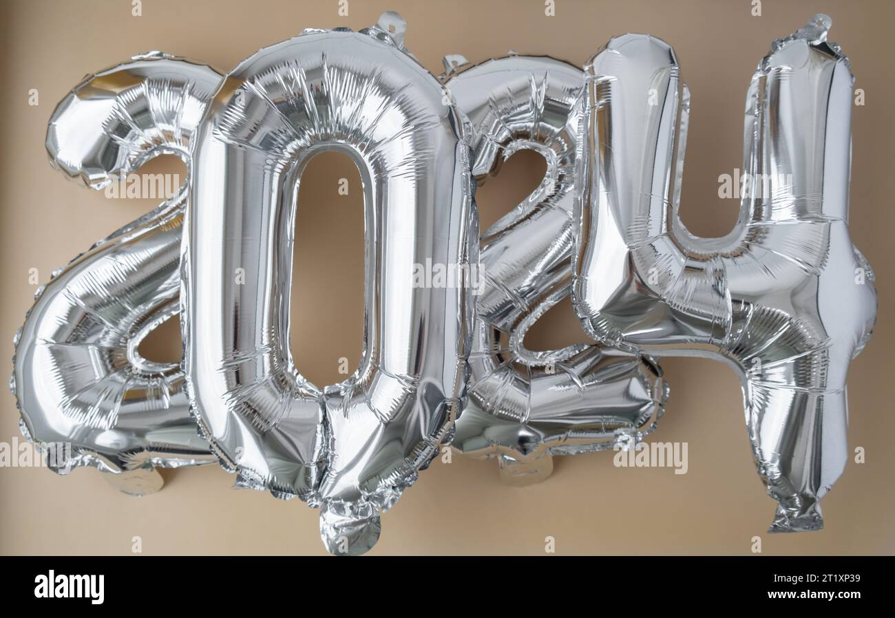 Happy new year 2024 metallic balloons on beige background. Greeting ...