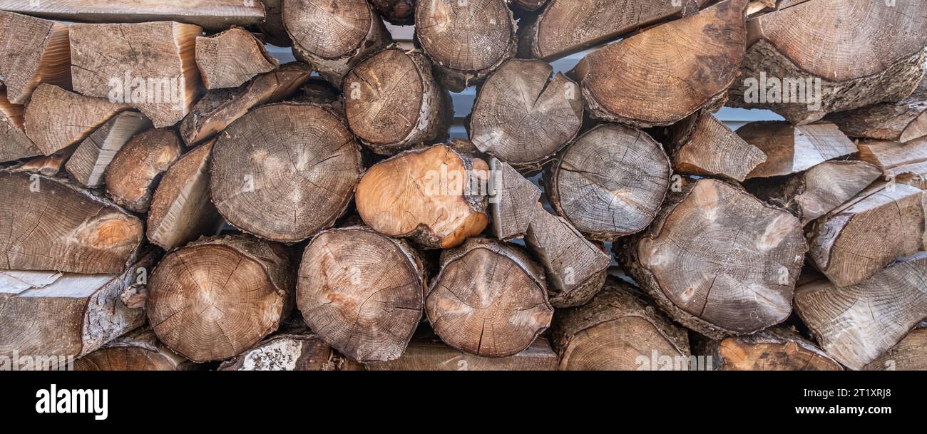 Stack of firewood behind a house Stock Photo - Alamy