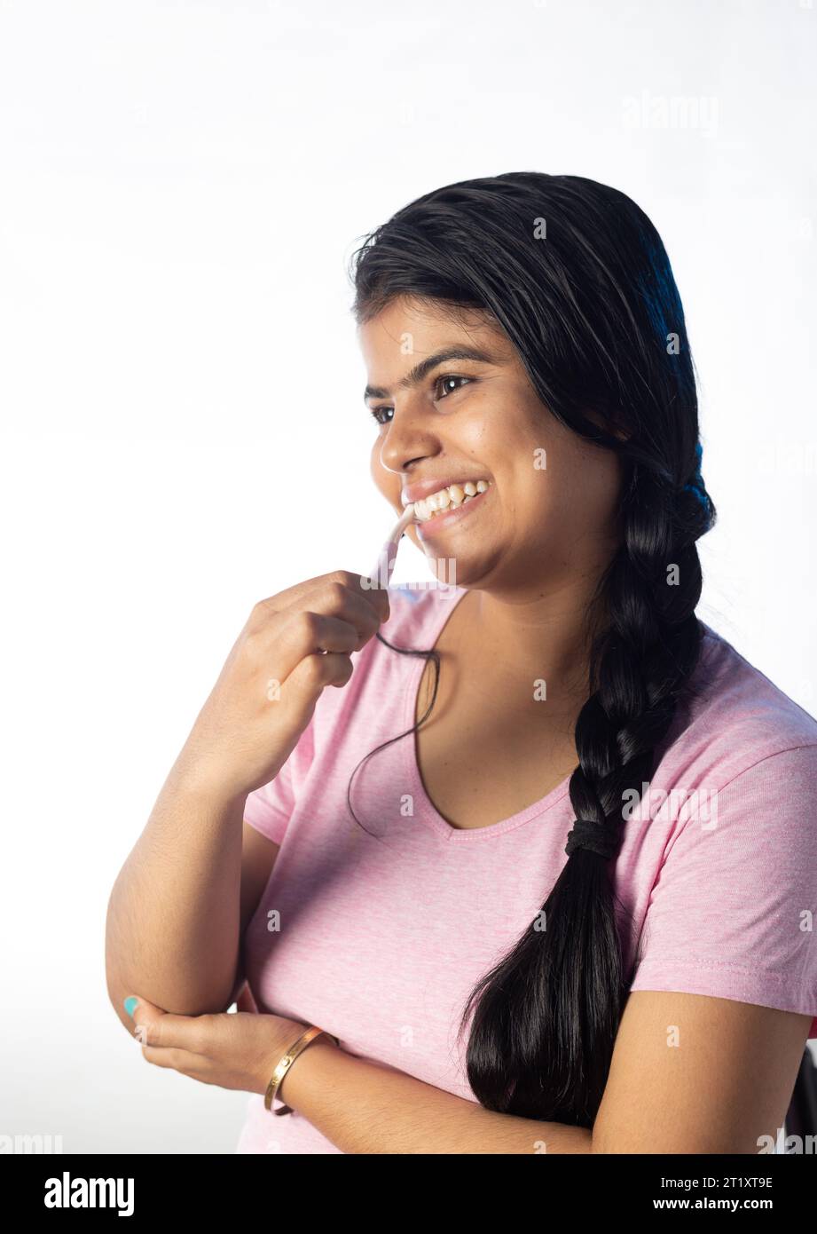 An Indian woman female girl brushing teeth on white background with ...