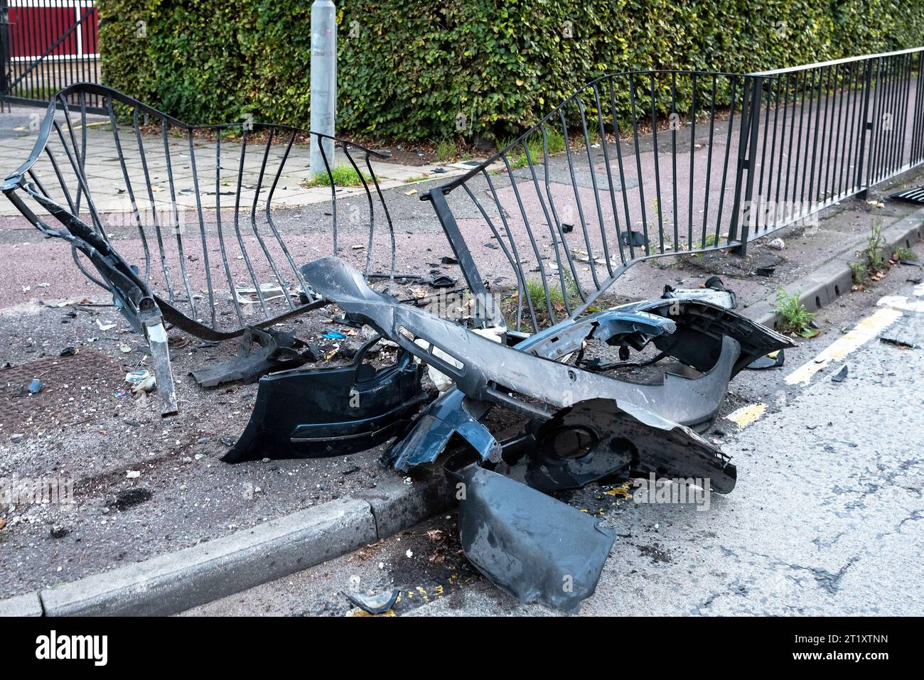 Serious vehicle impact damage to roadside pavement pedestrian barrier ...