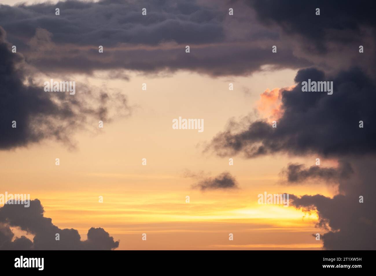 Dramatic clouds at sunrise/sunset sky over the horizon of the Caribbean ...