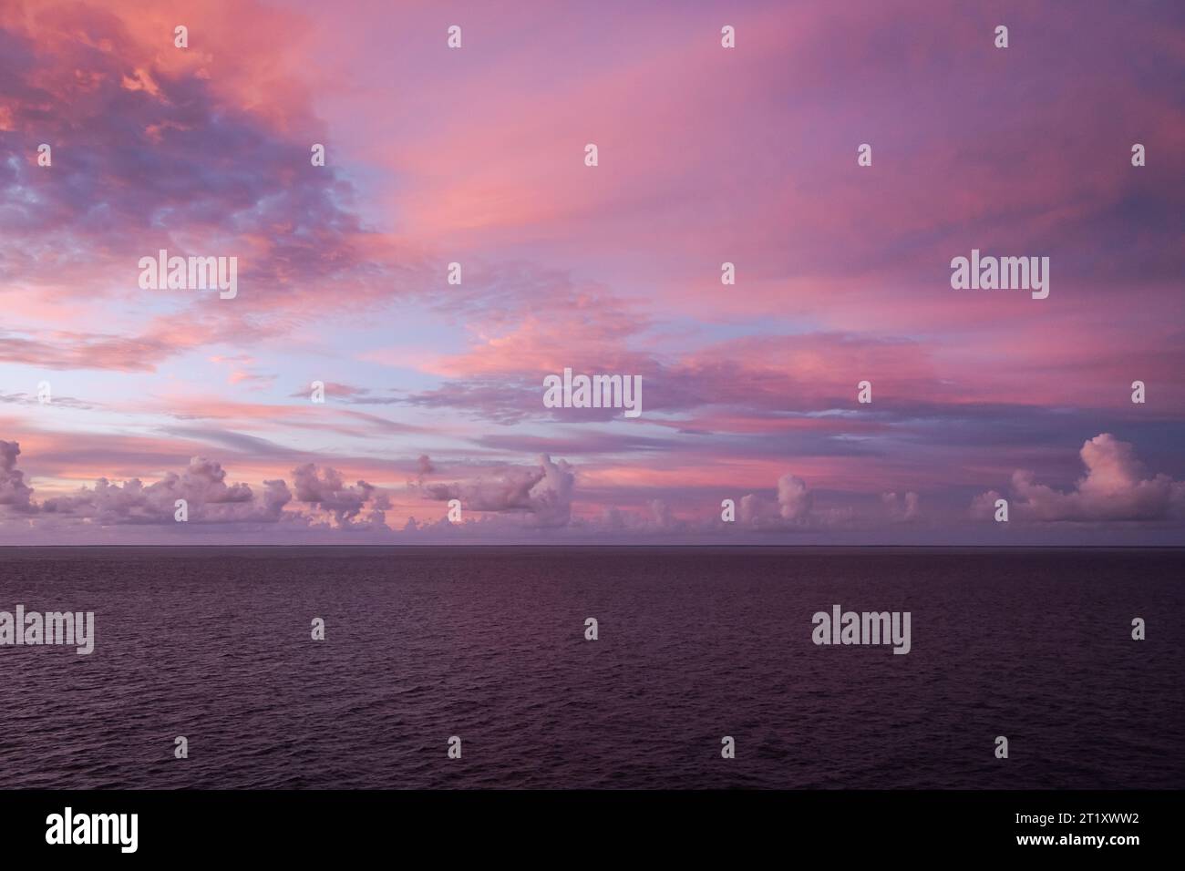 Dramatic clouds at sunrise/sunset sky over the horizon of the Caribbean ...