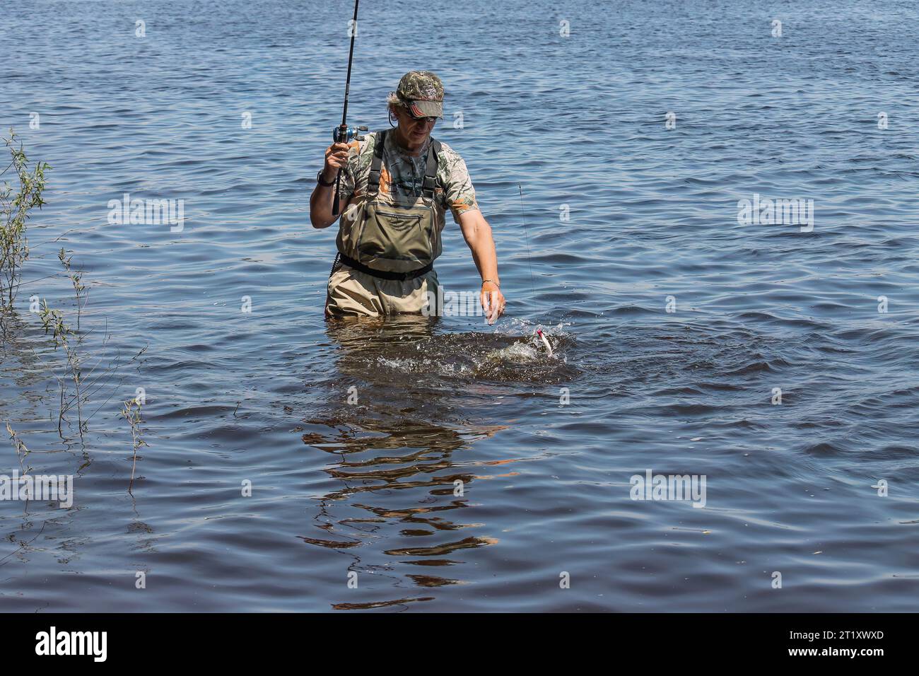 Fishing. One of a series of photos of fishermen catching northern pike ...