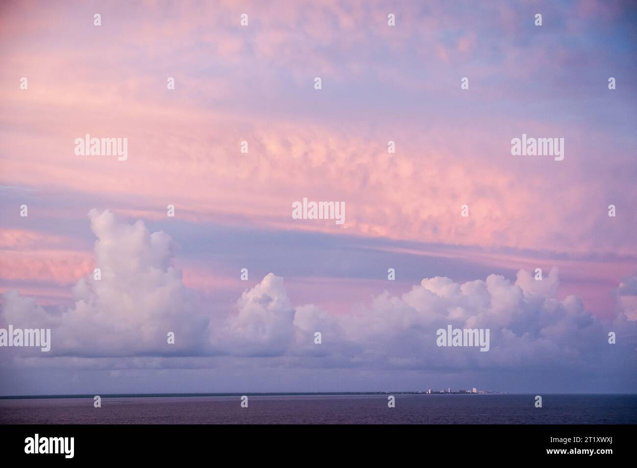 Dramatic clouds at sunrise/sunset sky over the horizon of the Caribbean ...