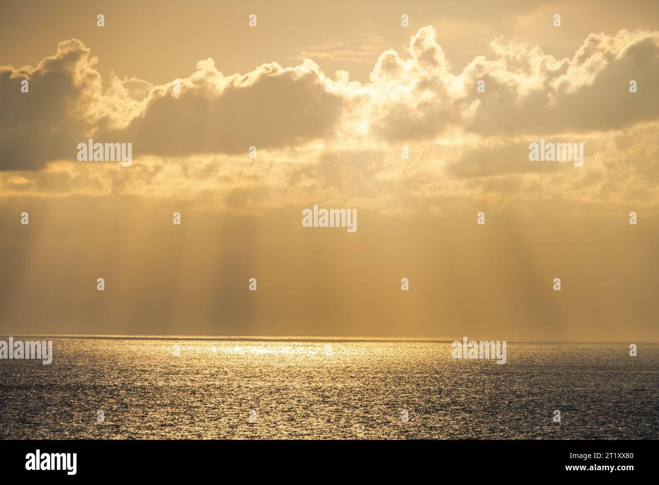Dramatic clouds at sunrise/sunset sky over the horizon of the Caribbean ...