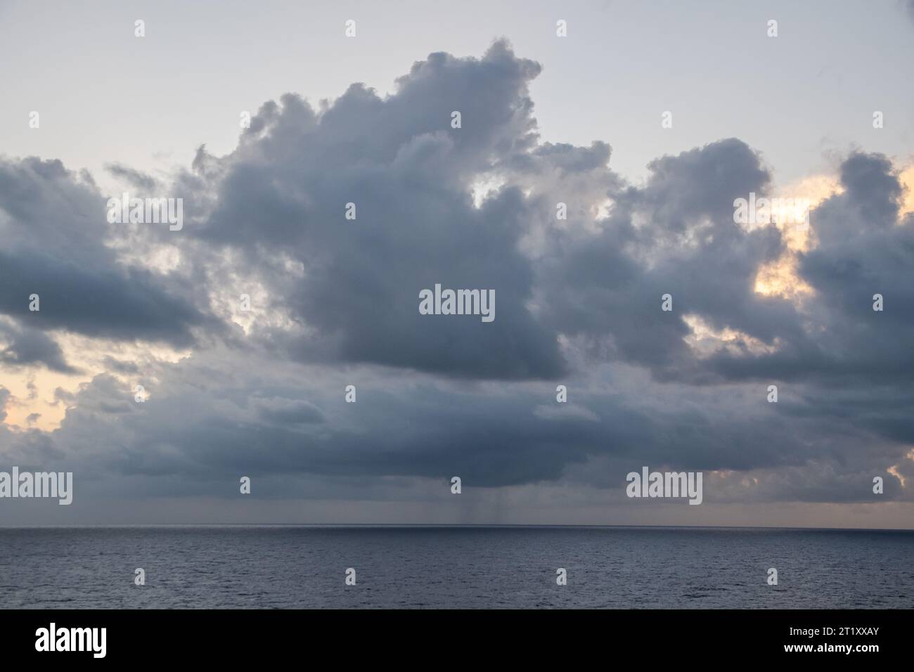Dramatic clouds at sunrise/sunset sky over the horizon of the Caribbean ...