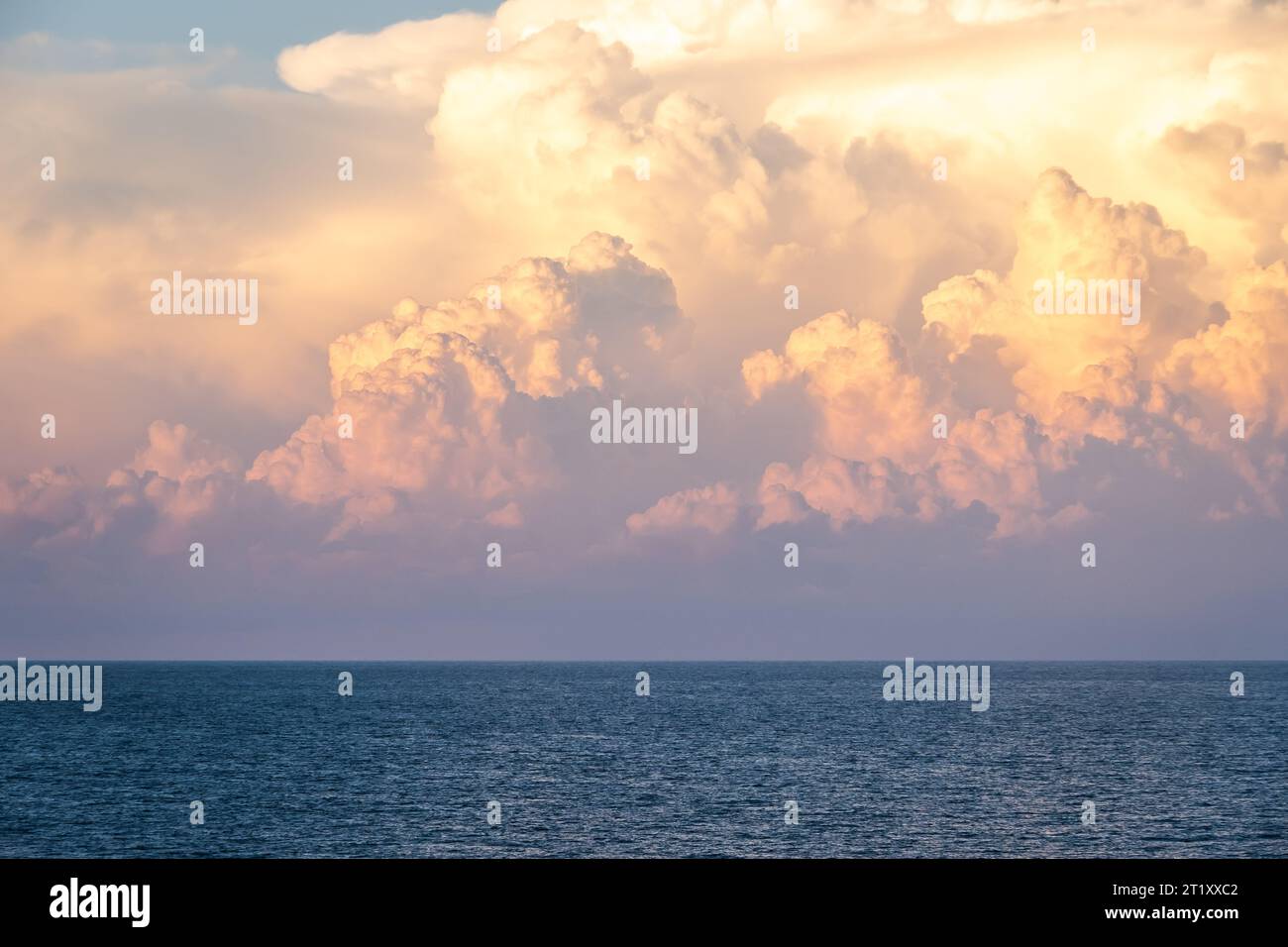 Dramatic clouds at sunrise/sunset sky over the horizon of the Caribbean ...