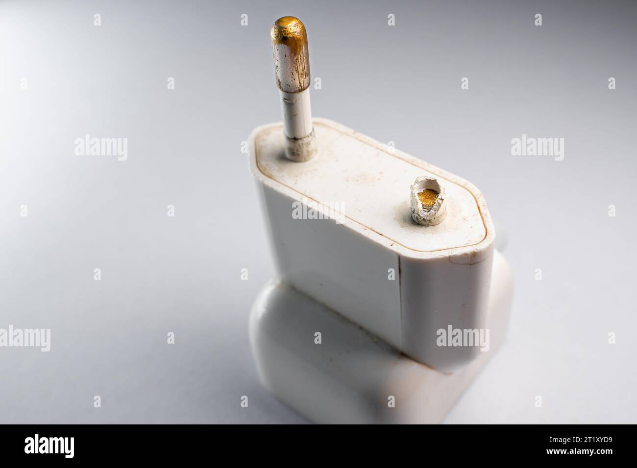 Broken pin contact of a plug, close-up. Universal adapter for ...