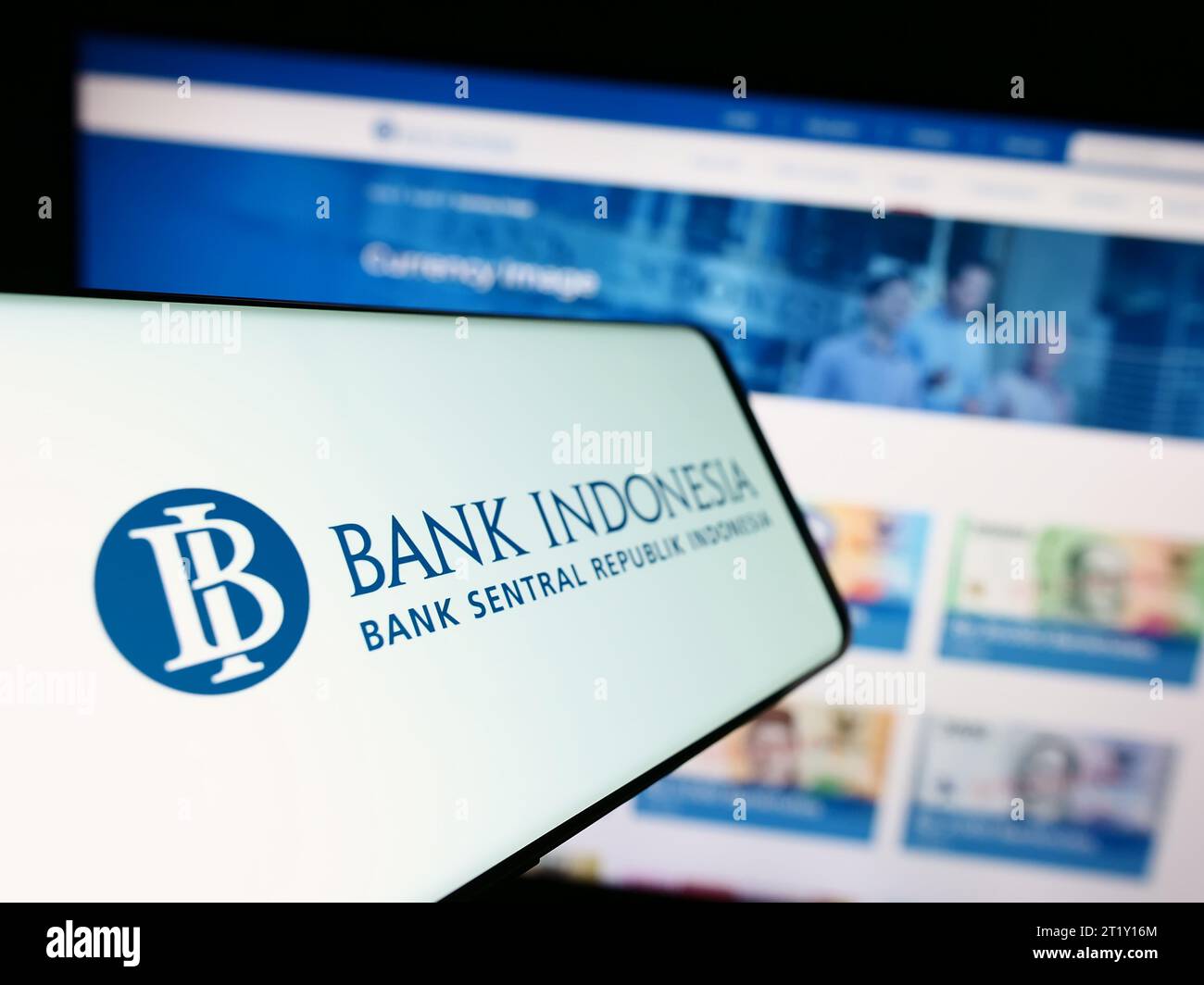 Mobile phone with logo of Indonesian financial institution Bank ...